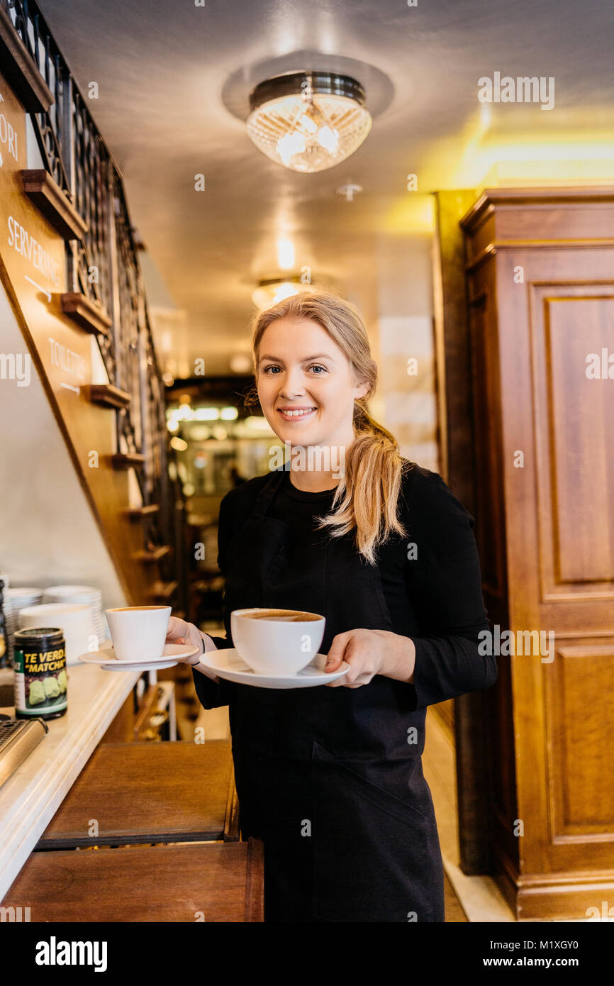 Waitress at bakery in Sweden Stock Photo - Alamy