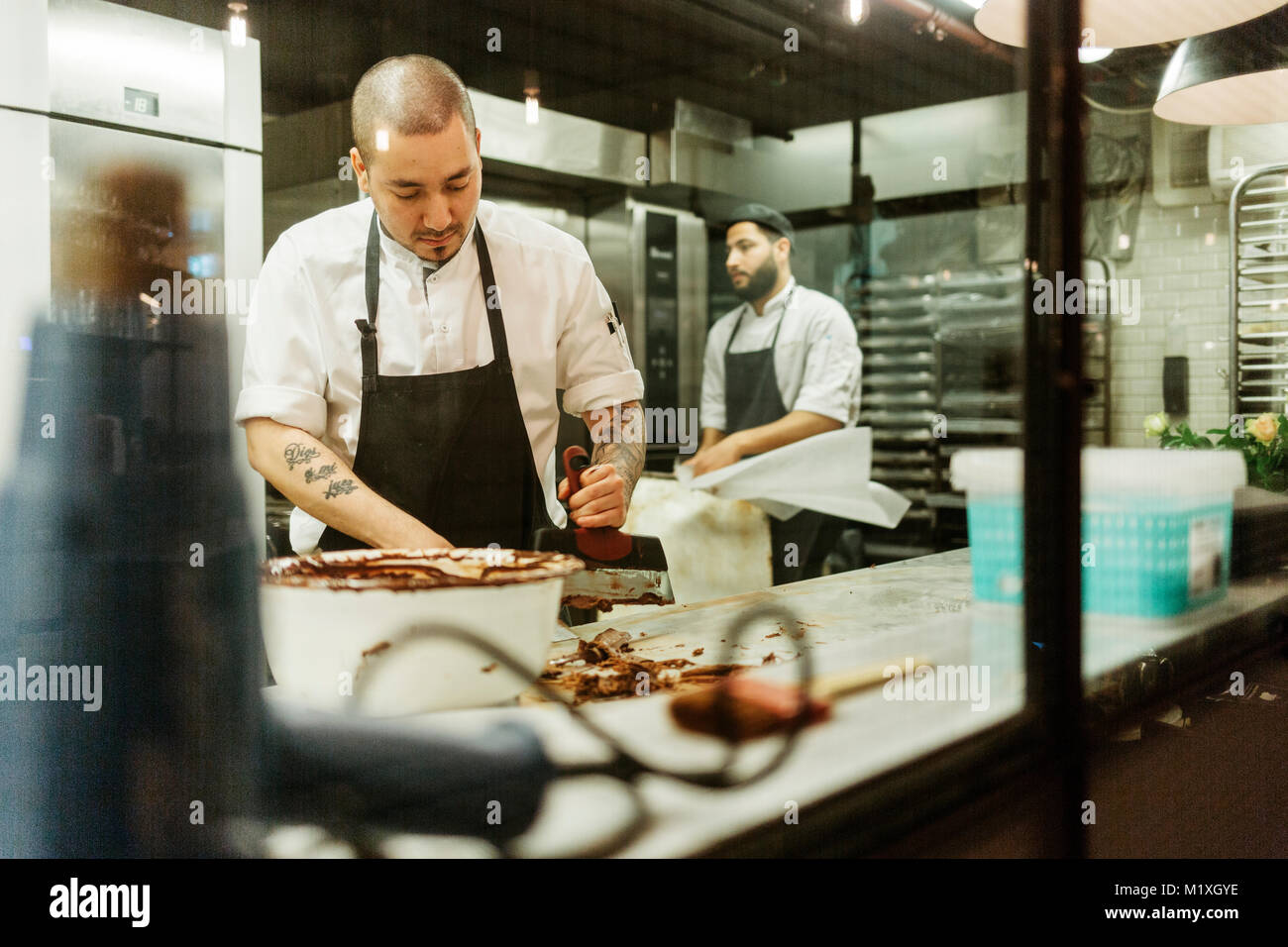 Chefs in kitchen Stock Photo - Alamy