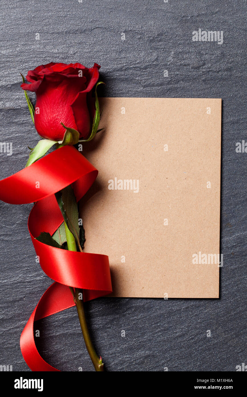 Red rose with a blank card for your message Stock Photo - Alamy