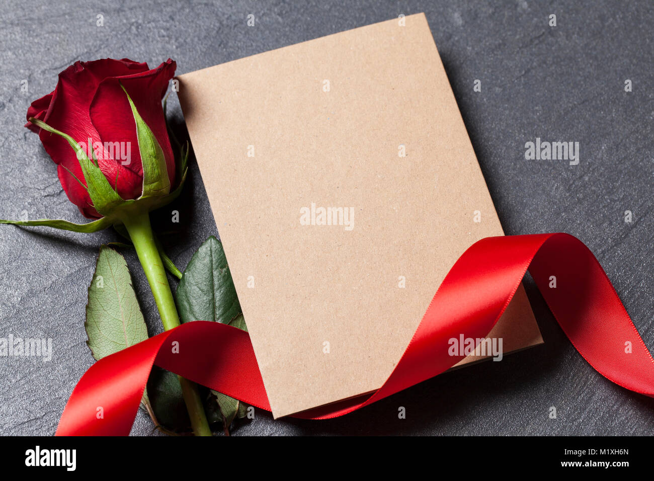 Red rose with a blank card for your message Stock Photo - Alamy