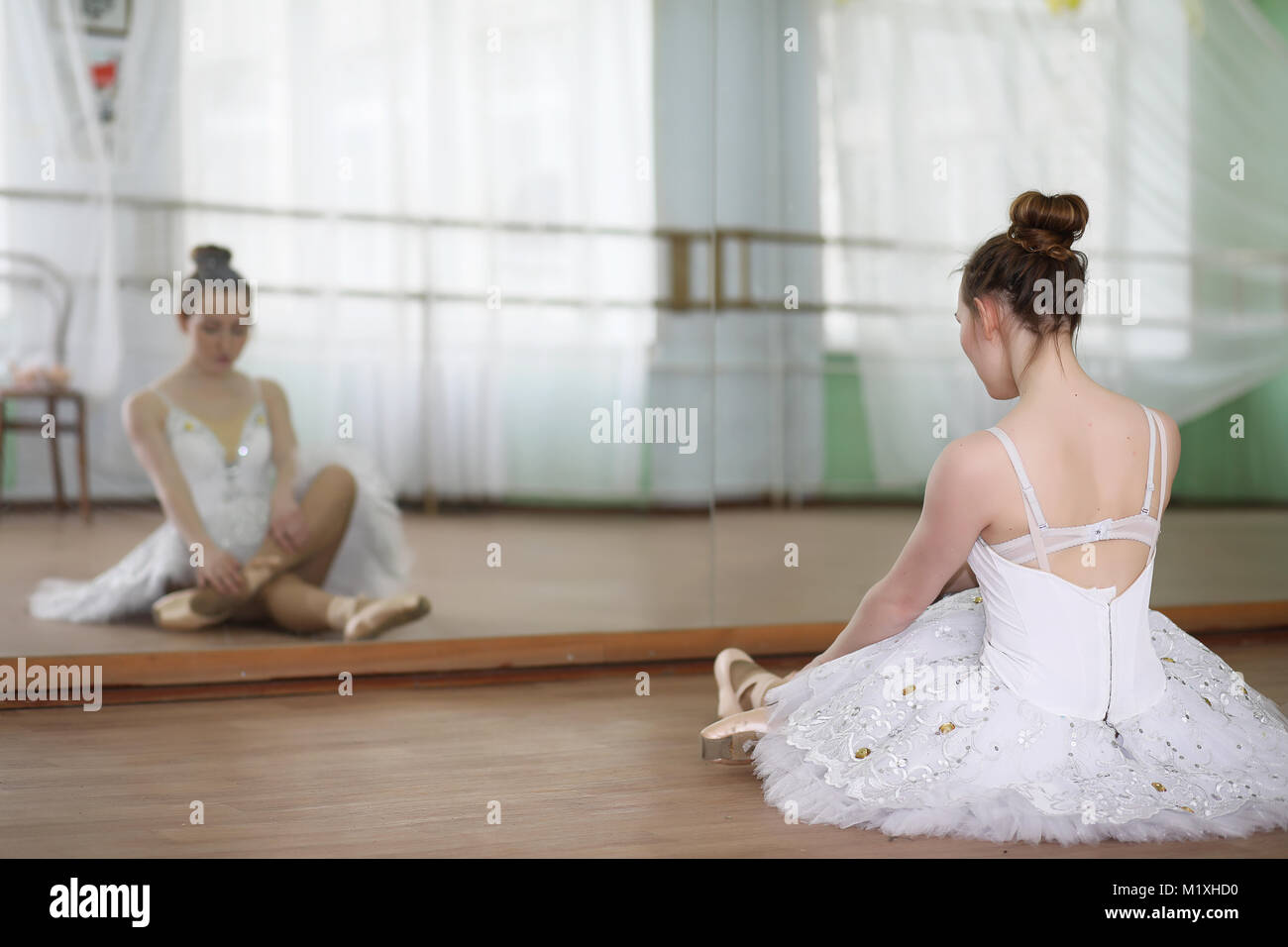 Pretty girl ballet dancer practicing Stock Photo - Alamy