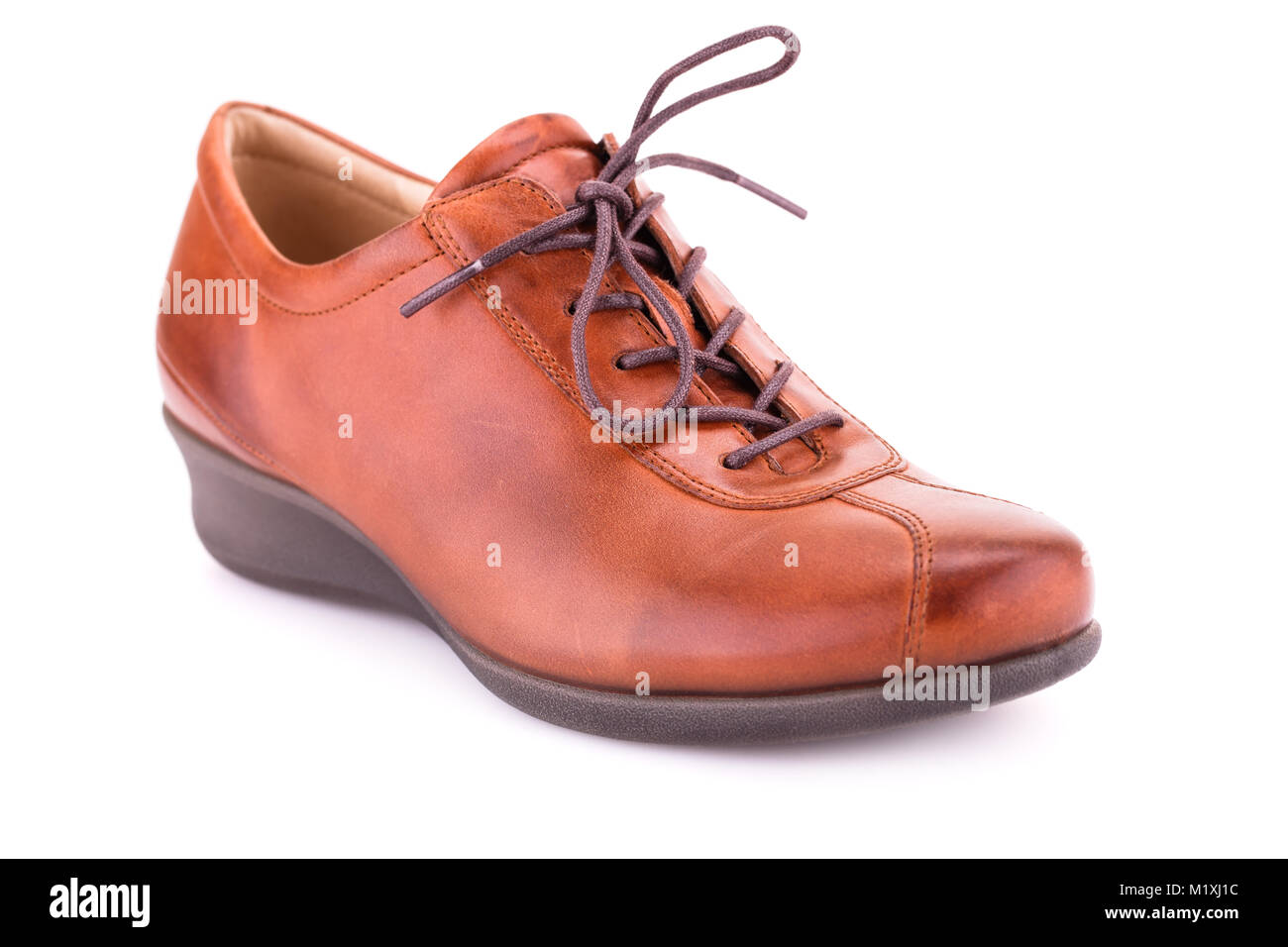 Brown shoe isolated on white background Stock Photo - Alamy