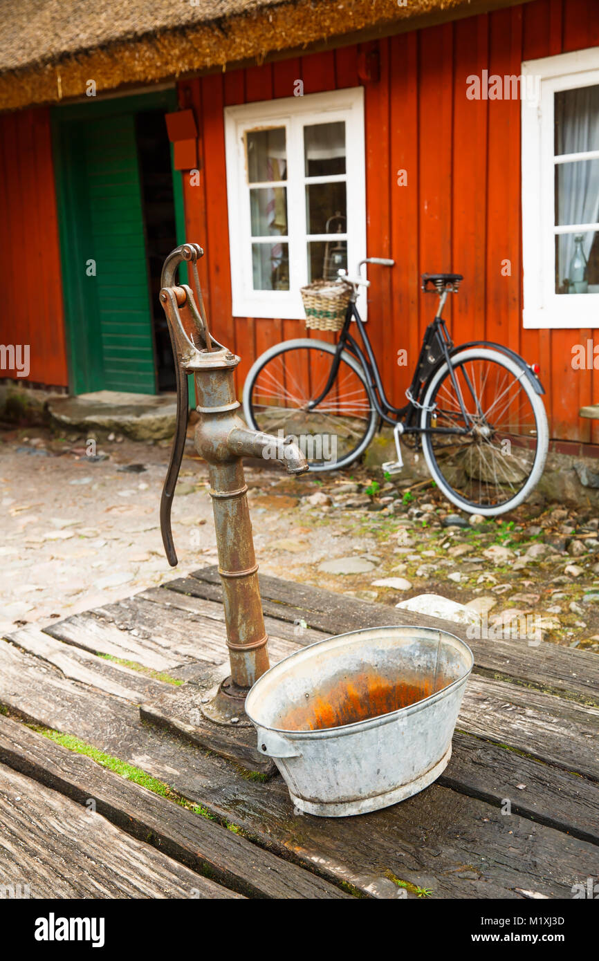 Traditional old water tap in rural backyard at Skansen, the first open ...
