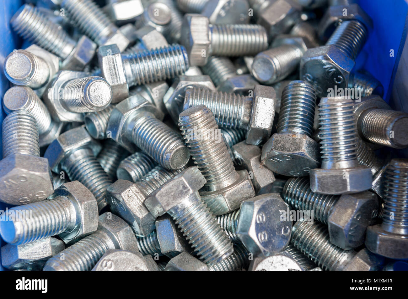 Box full of bolts Stock Photo - Alamy