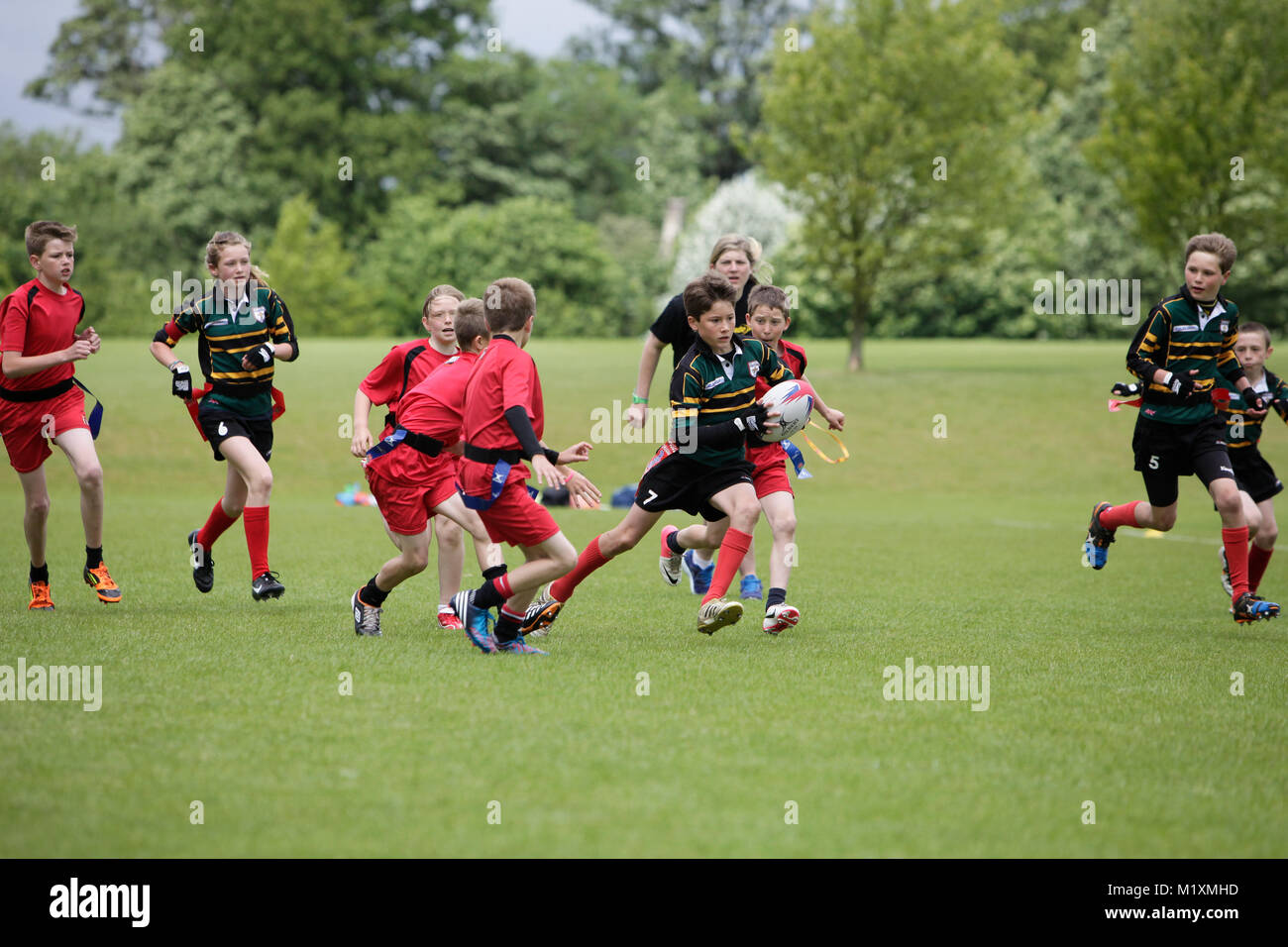 Children playing tag rugby hi-res stock photography and images - Alamy