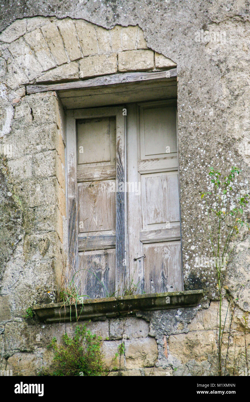 Old ruined window in the medieval castle of the town of Tufo in Irpinia ...