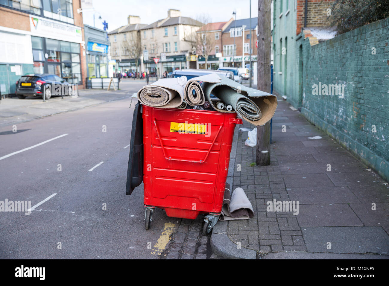 Over flowing rubbish bin Stock Photo - Alamy