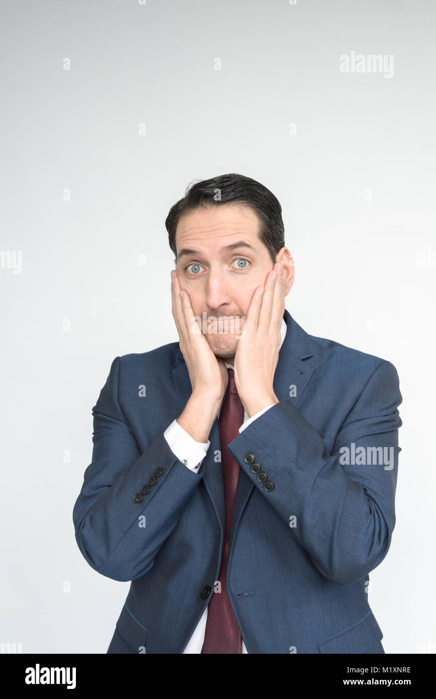 A smartly dressed man conveys a range of facial and bodily emotions ...