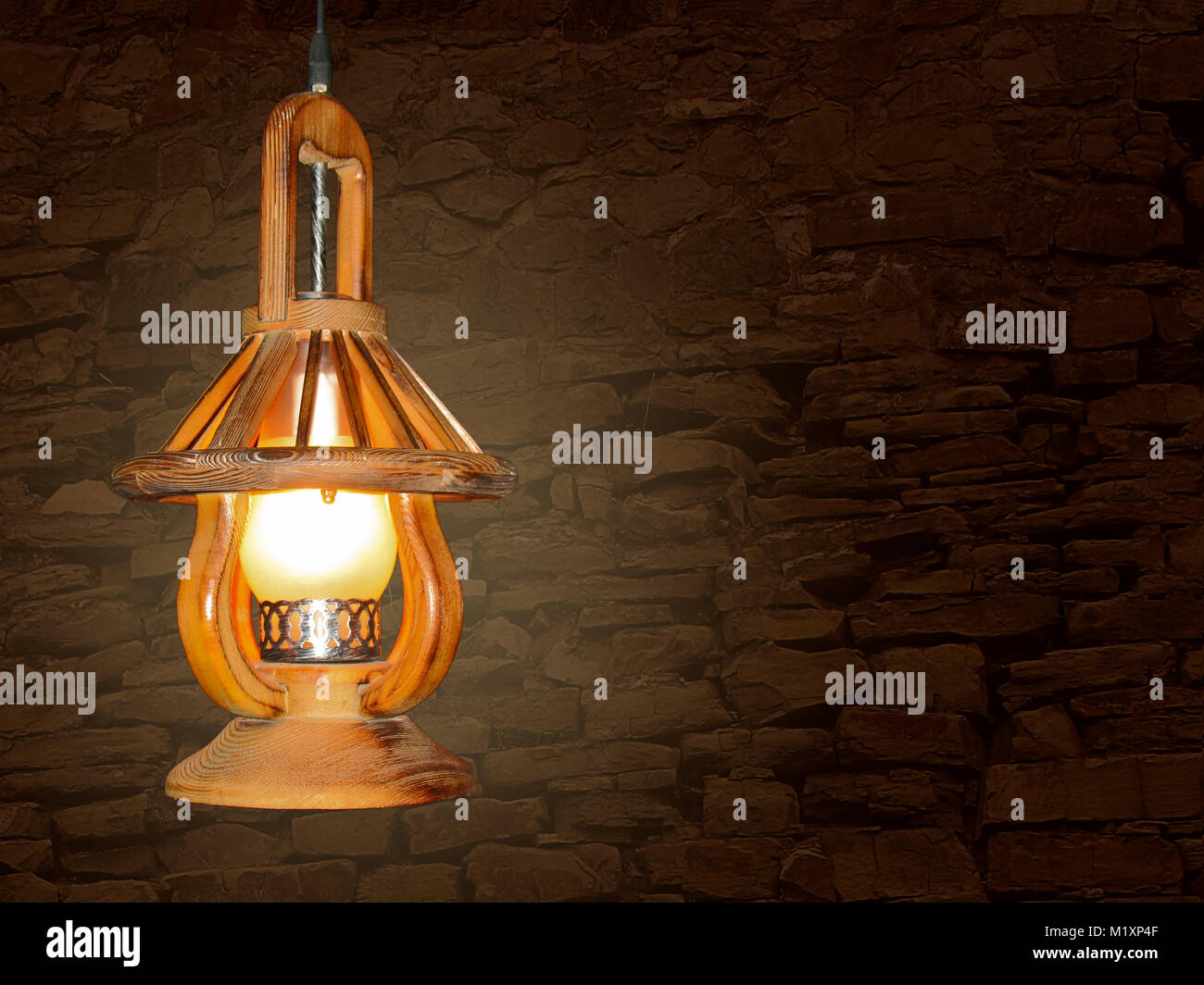 Magical romantic shimmer of vintage old wooden burning lamp hanging on ...