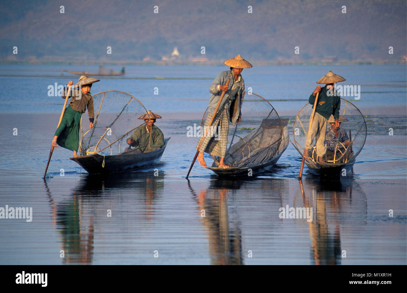 Myanmar (Burma). Inle Lake. Fishermen of Intha-tribe fishing in ...
