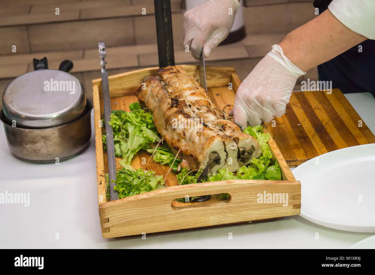 Delicious baked chicken in hand cook Stock Photo - Alamy