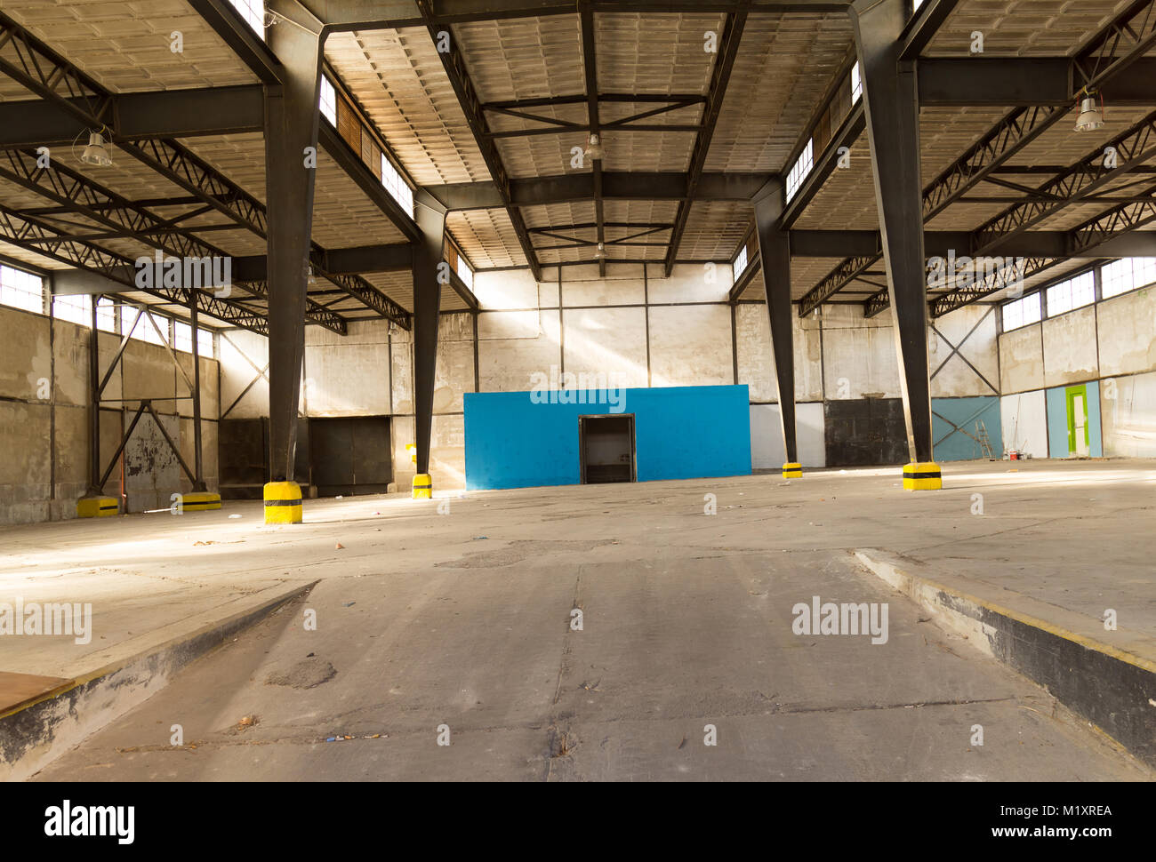 Inside of Empty old hangar for design Stock Photo - Alamy