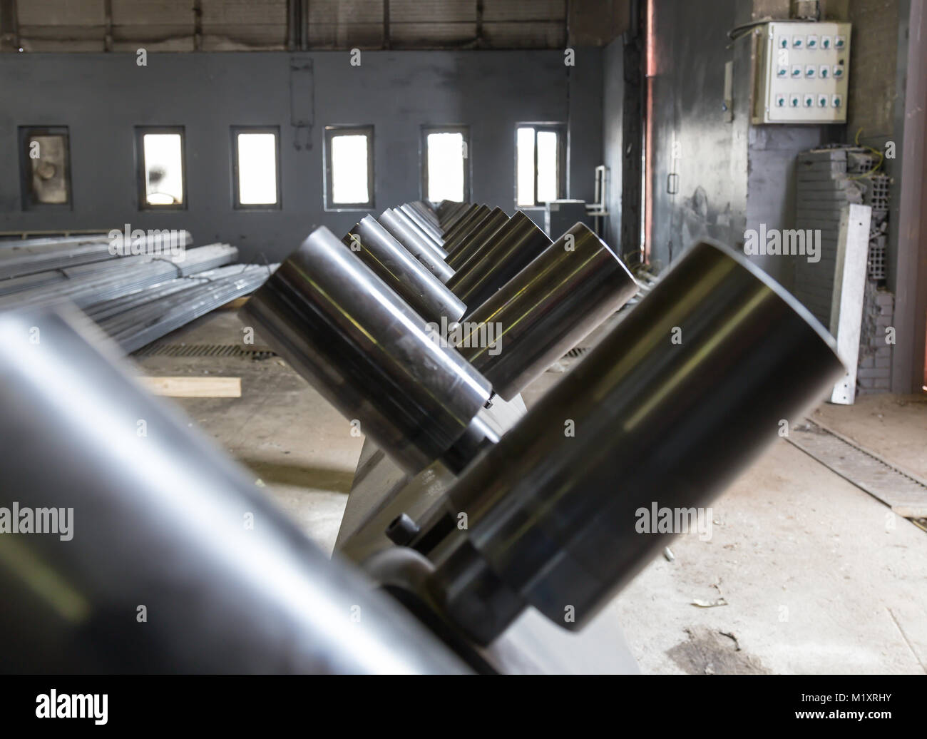 Steel material in row in the factory Stock Photo - Alamy