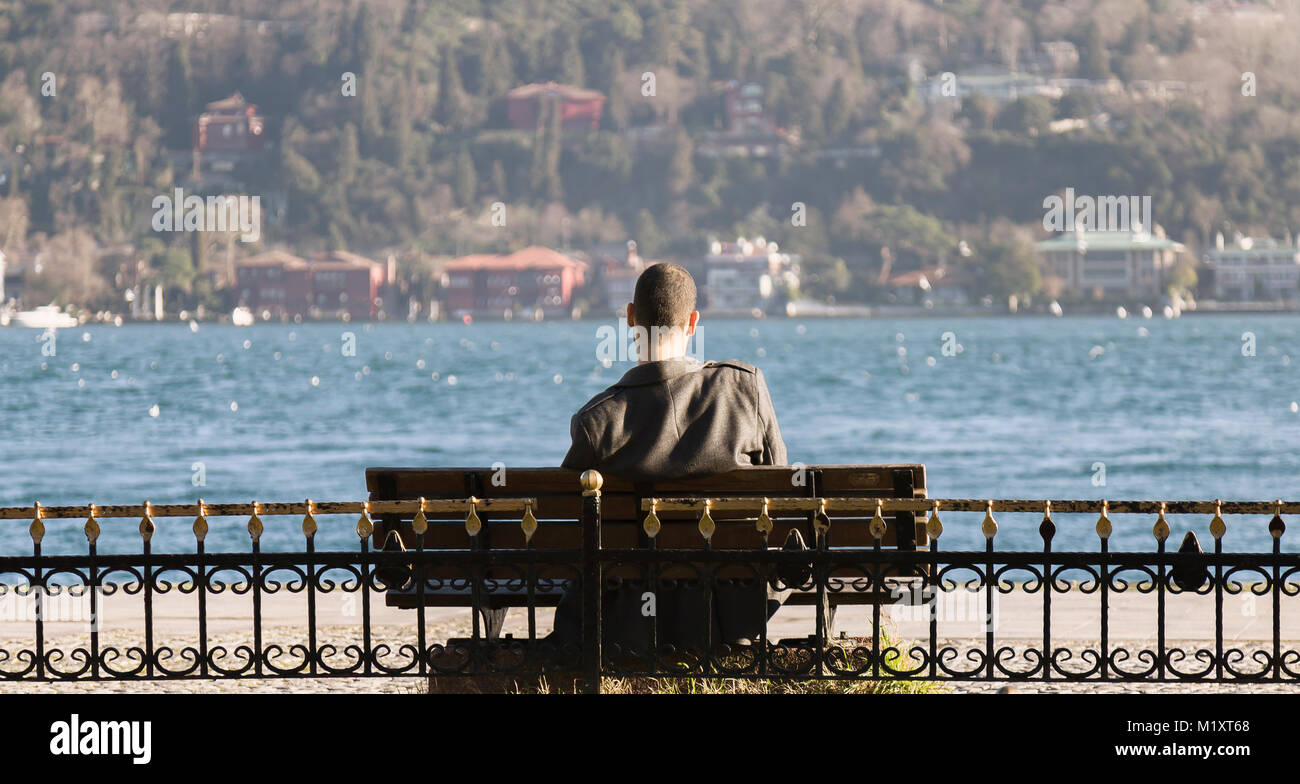 Single man standing on the bench near the bosphorus at Istanbul Stock ...