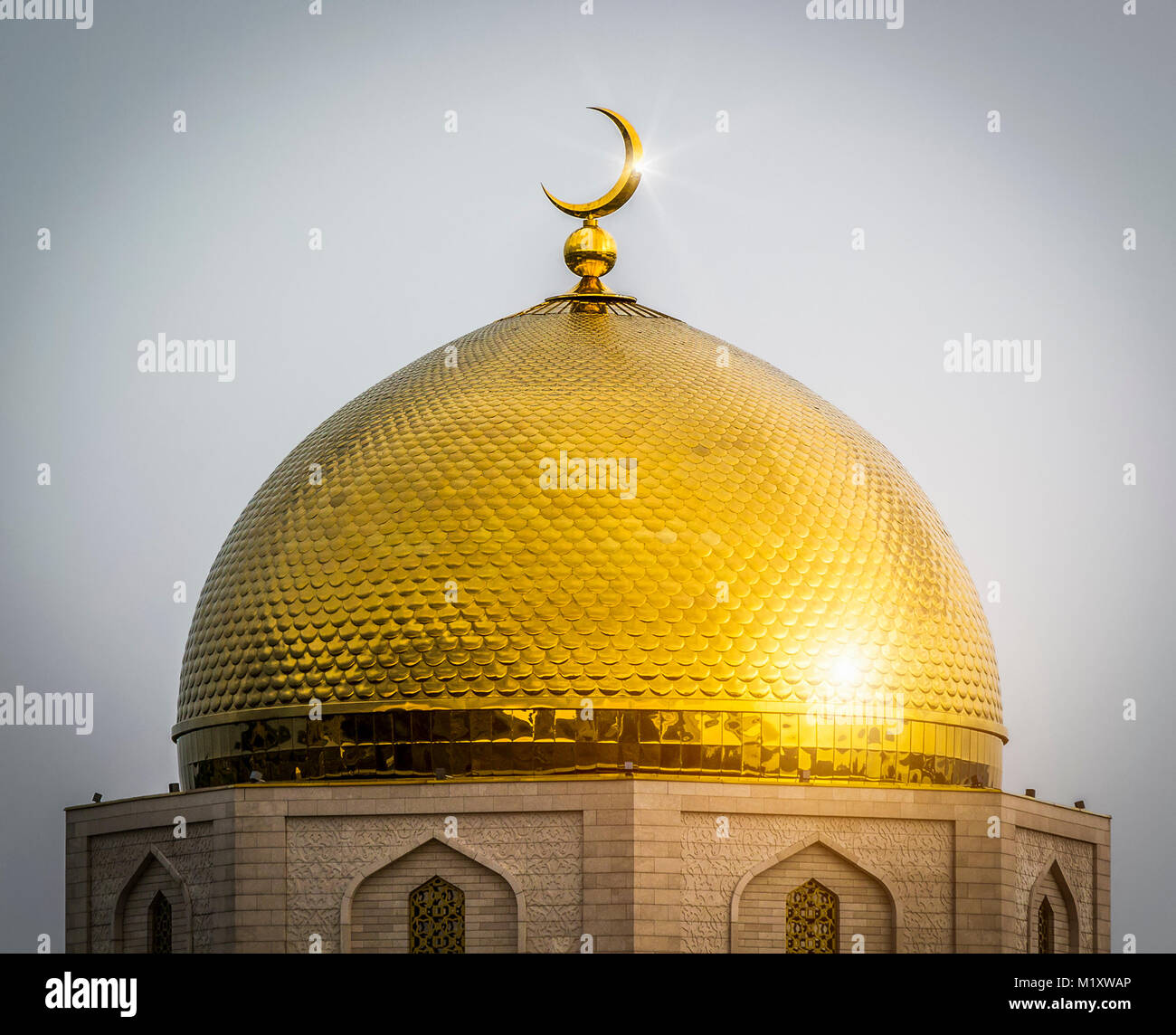 The gilded dome of the mosque glares in the sun Stock Photo - Alamy
