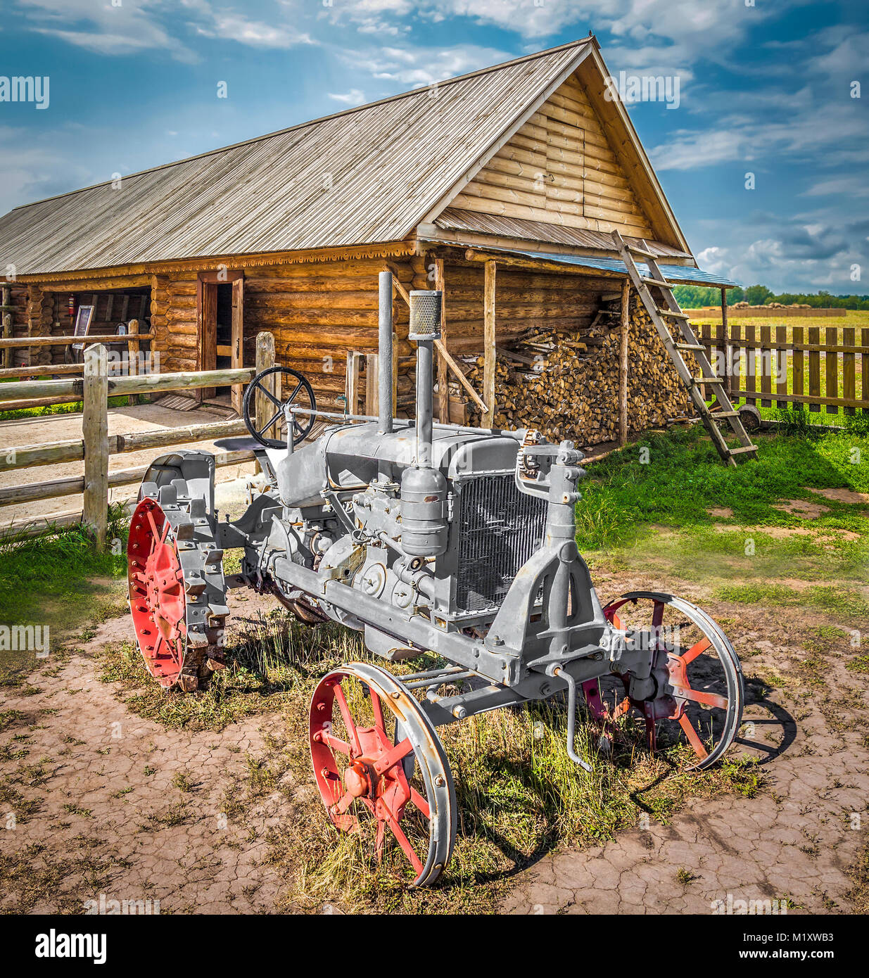 Very old tractor on iron wheels on a rural farm Stock Photo - Alamy