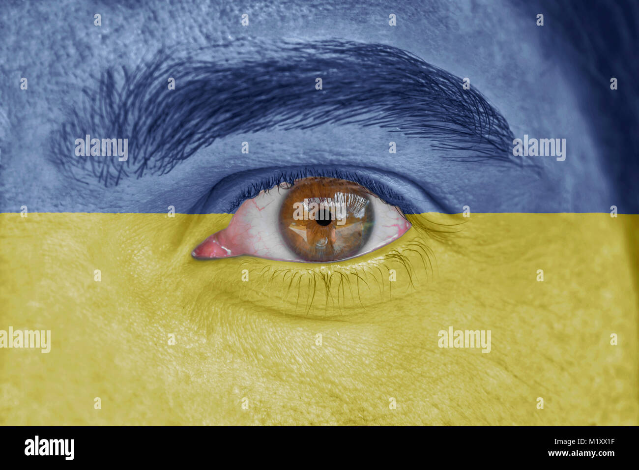 Human face and eye painted with flag of Ukraine Stock Photo - Alamy