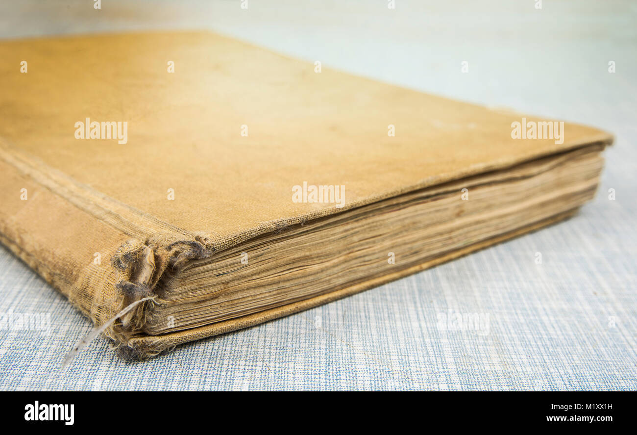Old worn out vintage books on the table Stock Photo - Alamy