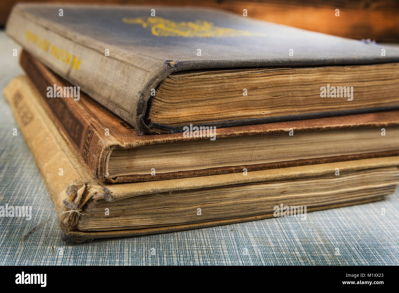 Old worn out vintage books on the table Stock Photo - Alamy