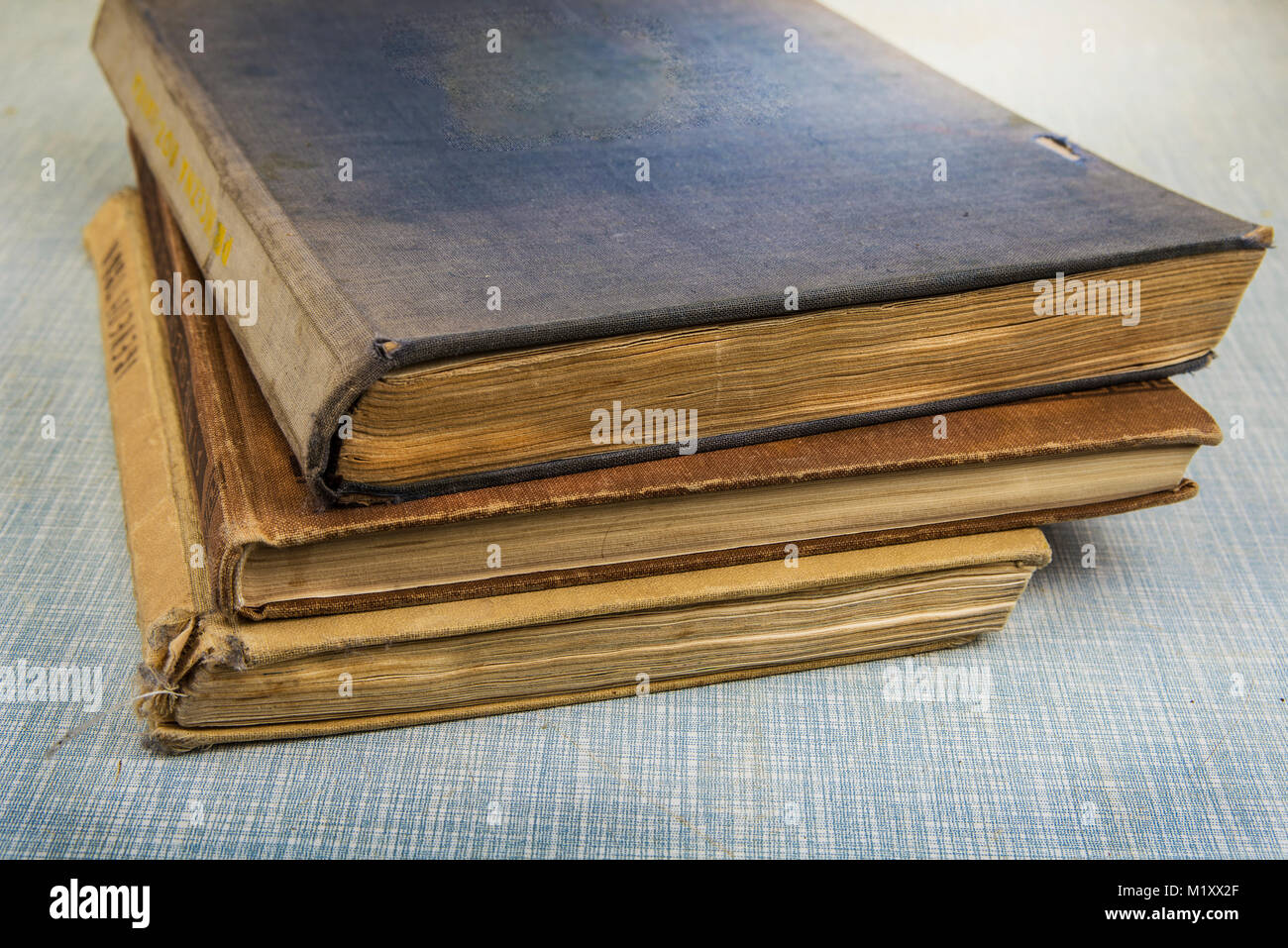 Old worn out vintage books on the table Stock Photo - Alamy