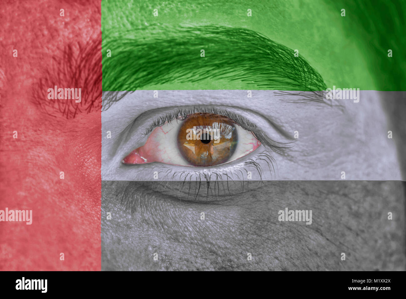 Human face and eye painted with flag of United Arab Emirates Stock ...