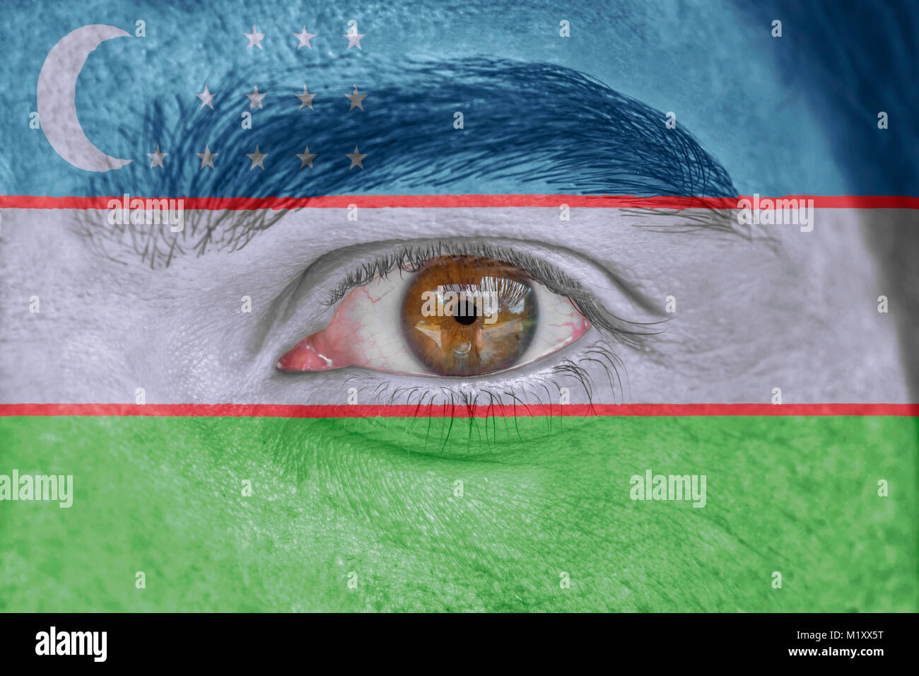 Human face and eye painted with flag of Uzbekistan Stock Photo - Alamy