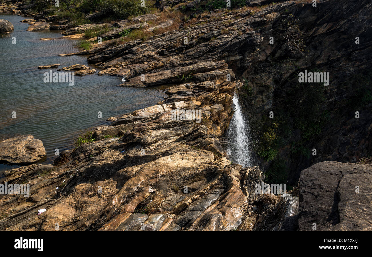 Waterfall in the summer showing rock formations made up over the years ...