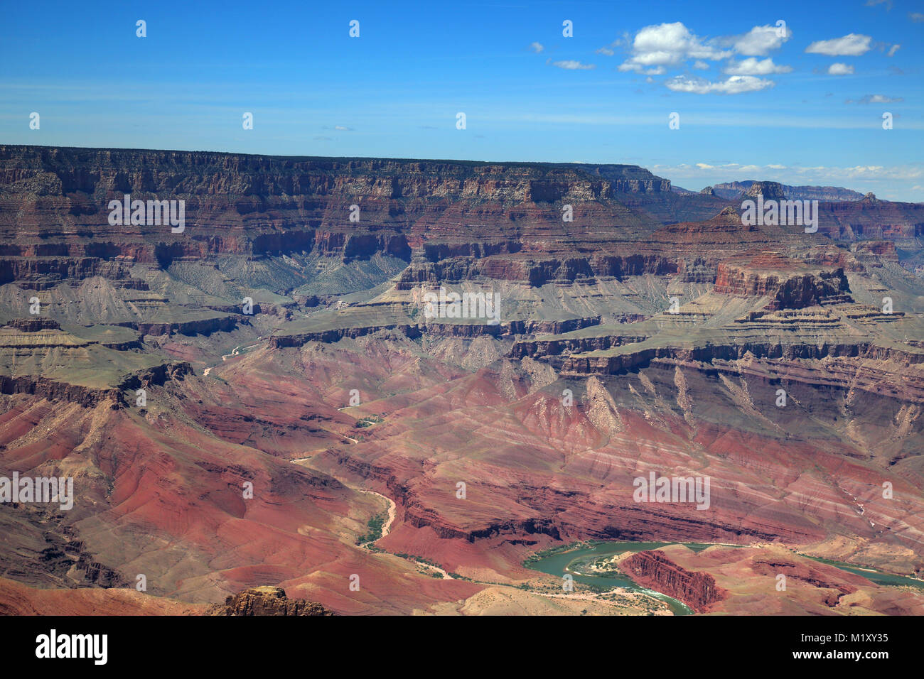 distant views of the colorado river flowing through the grand canyon in ...