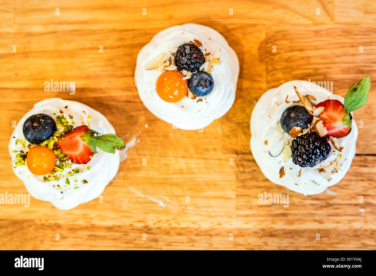 Homemade meringue cakes with fresh berries Stock Photo - Alamy