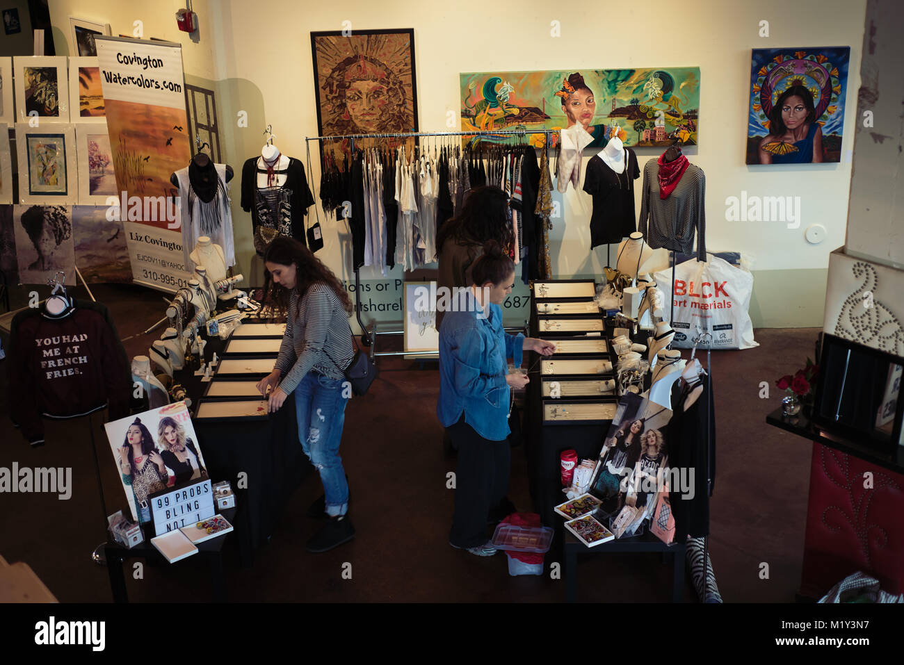 Two customers browsing items and arts from local artist for sale Stock ...