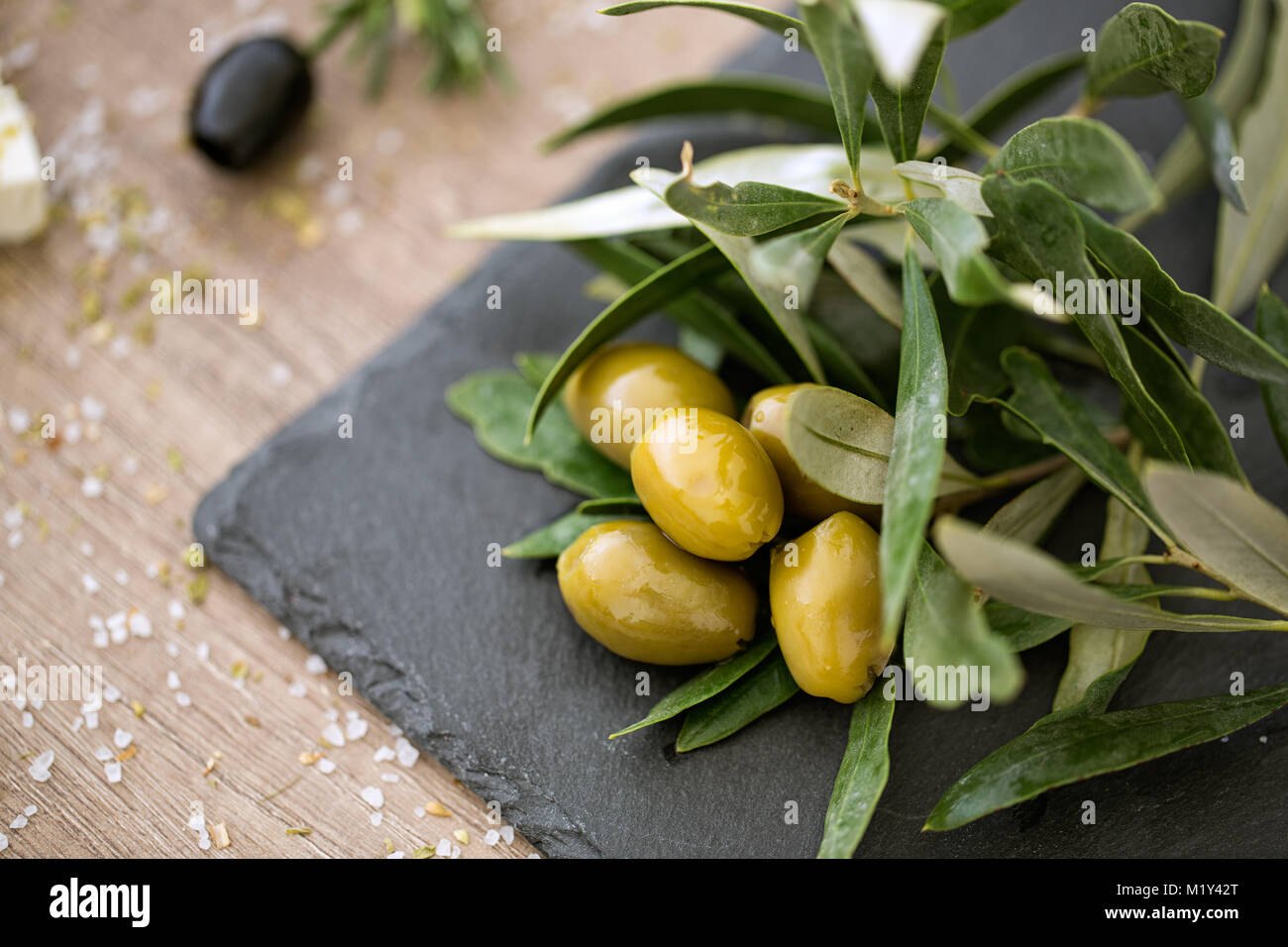 top view green olives on natural olive tree leaves background Stock ...