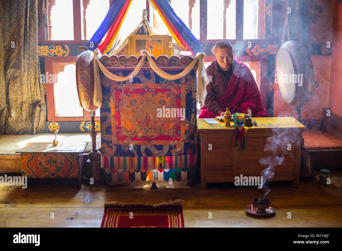 Paro, Bhutan. Buddhist Monk Reading Holy Scriptures in his Temple, the ...