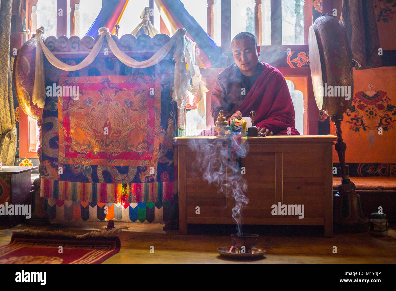 Paro, Bhutan. Buddhist Monk Reading Holy Scriptures in his Temple, the ...