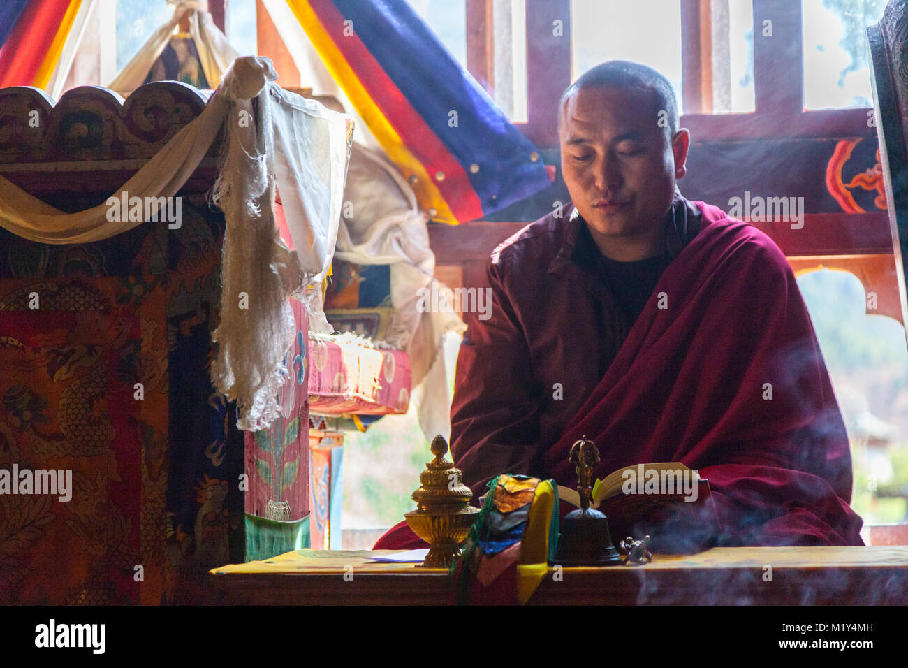 Paro, Bhutan. Buddhist Monk Reading Holy Scriptures in his Temple, the ...