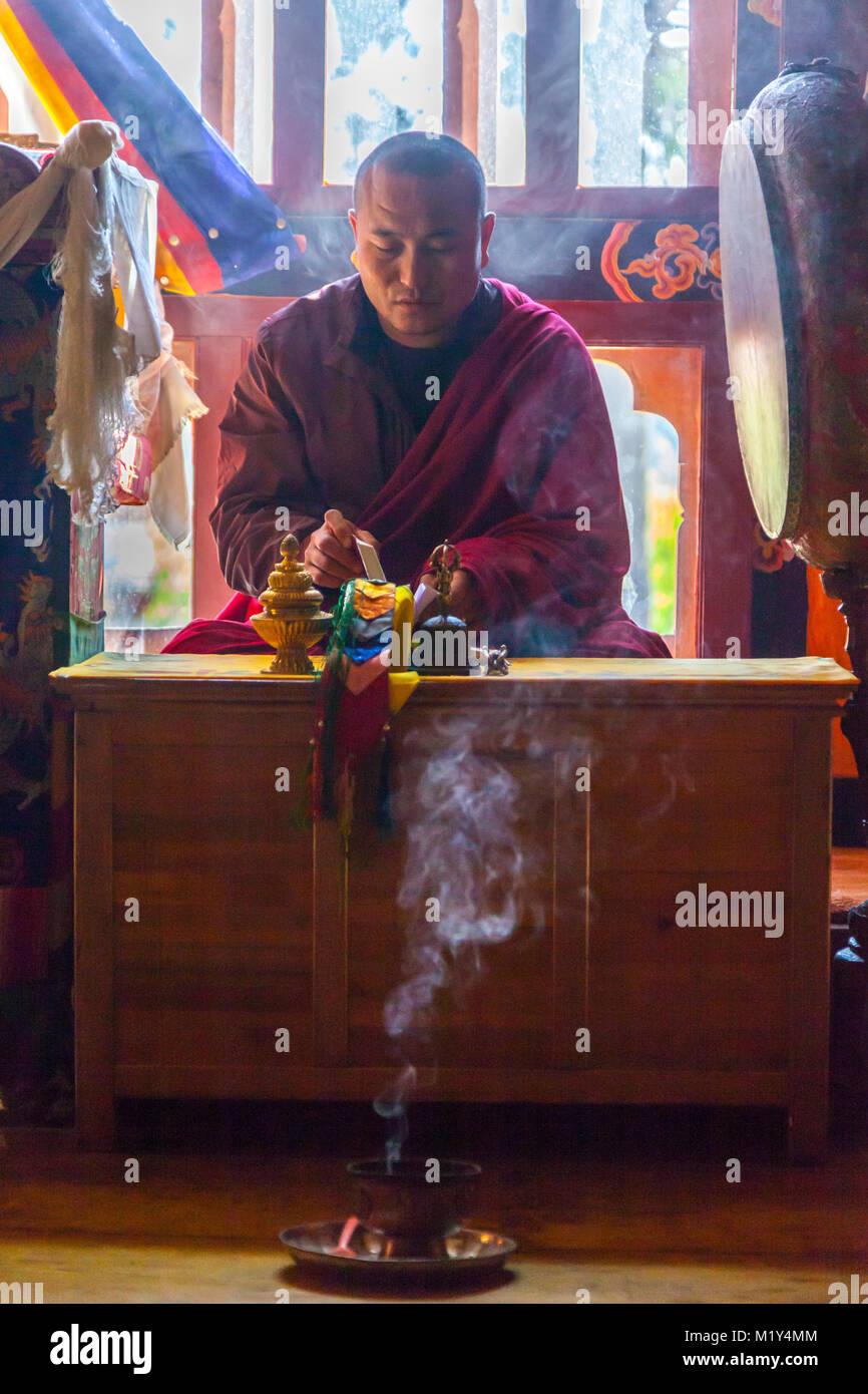 Paro, Bhutan. Buddhist Monk Reading Holy Scriptures in his Temple, the ...