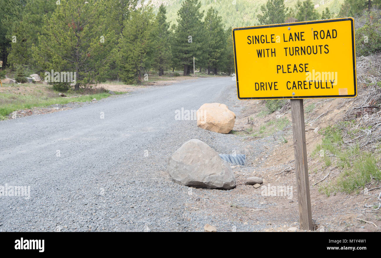 Gravel Road Warning Sign High Resolution Stock Photography and Images ...