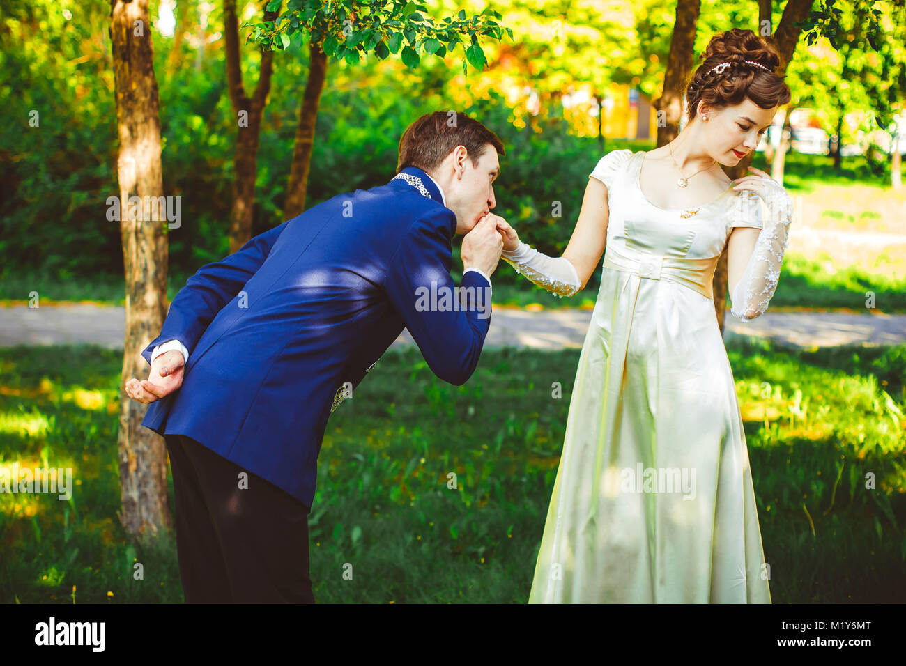 Gentleman. Man kisses a hand to lady Stock Photo - Alamy