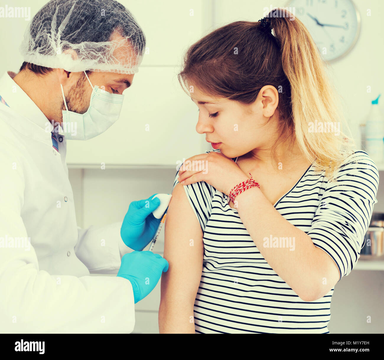 Teenager and doctor consulting room hi-res stock photography and images ...