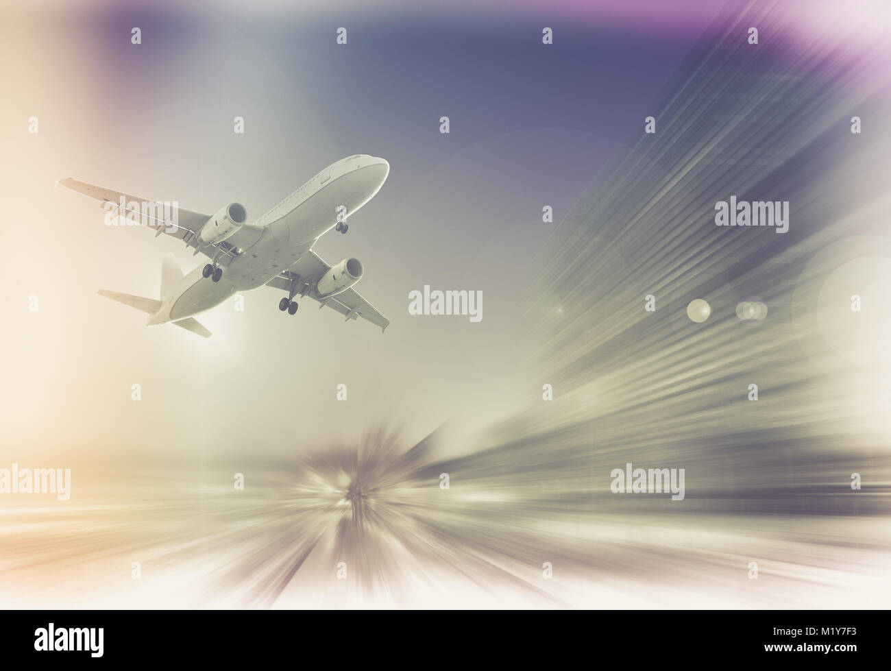 Big airplane taking up motion in sky on landscape blurred background ...