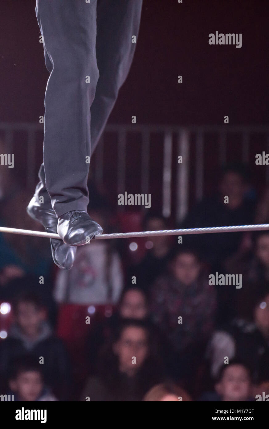 A man walks in a rope in a circus Stock Photo - Alamy