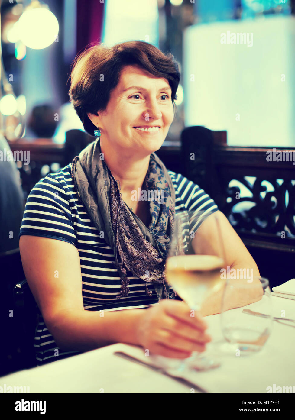 Elderly lonely woman at dinner in restaurant Stock Photo - Alamy