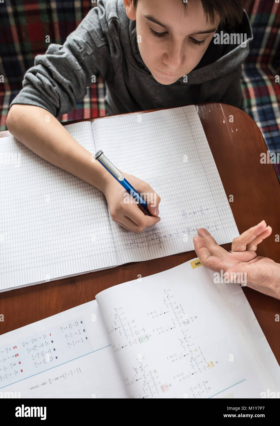 Boy do his homework. Notebook Stock Photo - Alamy