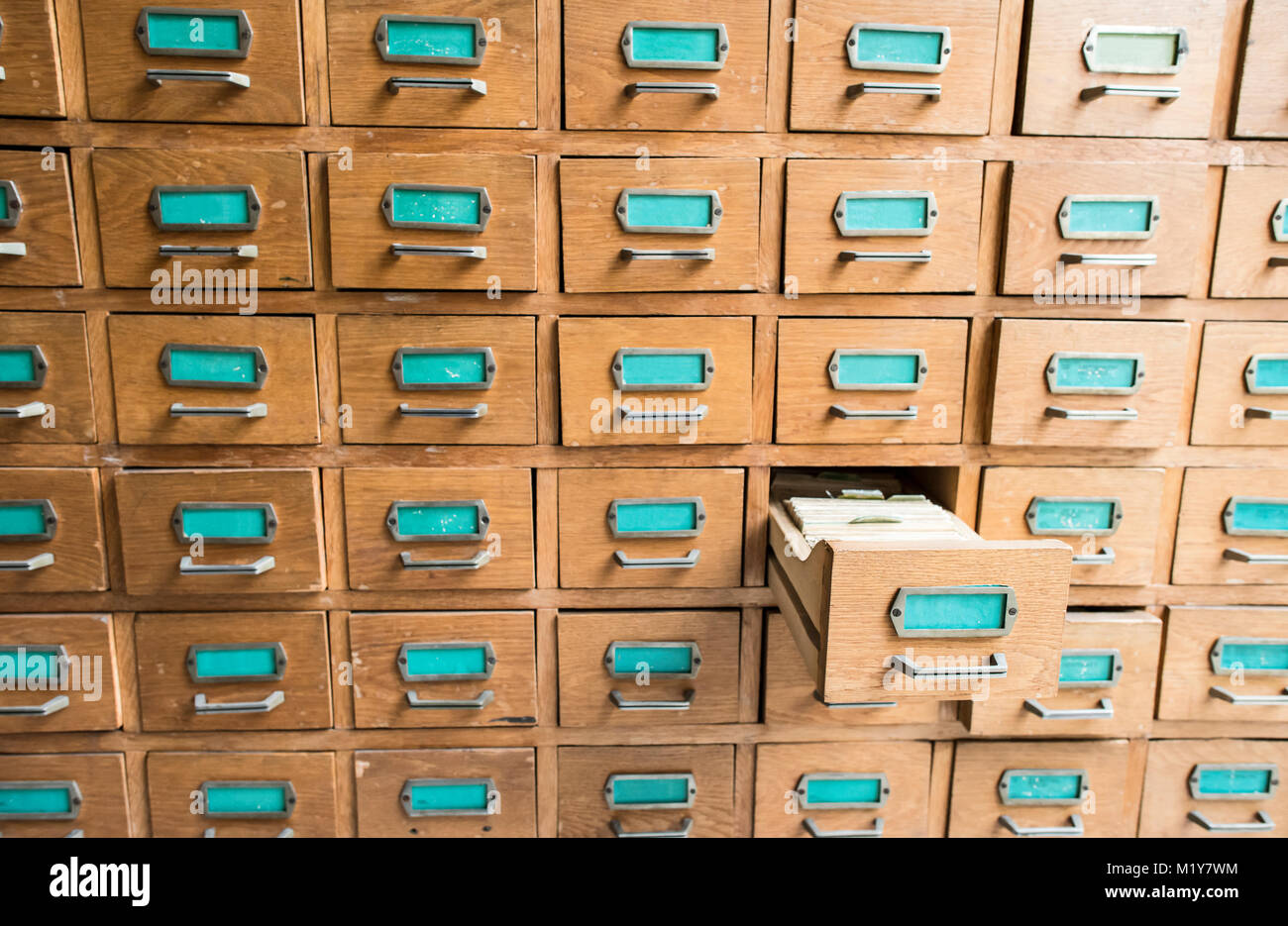 Drawers in archive. Wooden shelves Stock Photo - Alamy