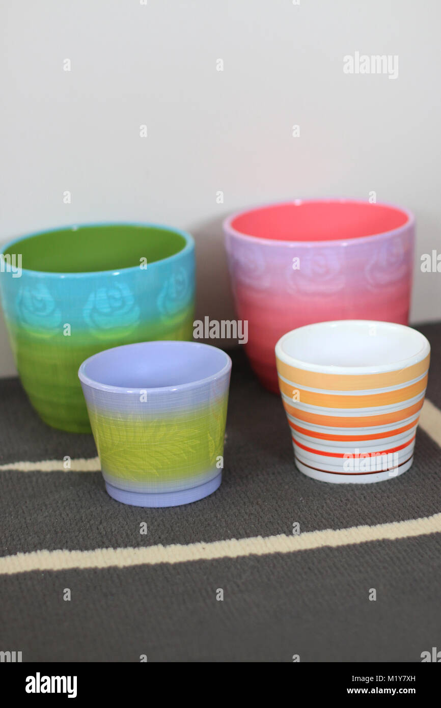 Colourful ceramic pot plants in different sizes Stock Photo - Alamy