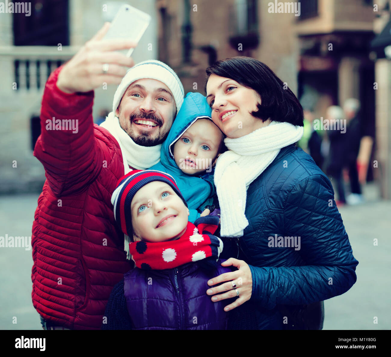 Dad and mom with their children making selfie together Stock Photo - Alamy