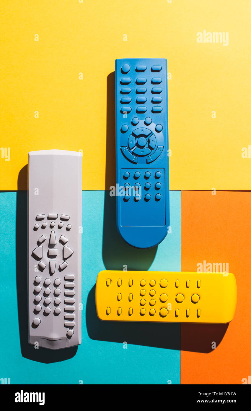 Many Colored TV remote controls on bright backgrounds Stock Photo - Alamy