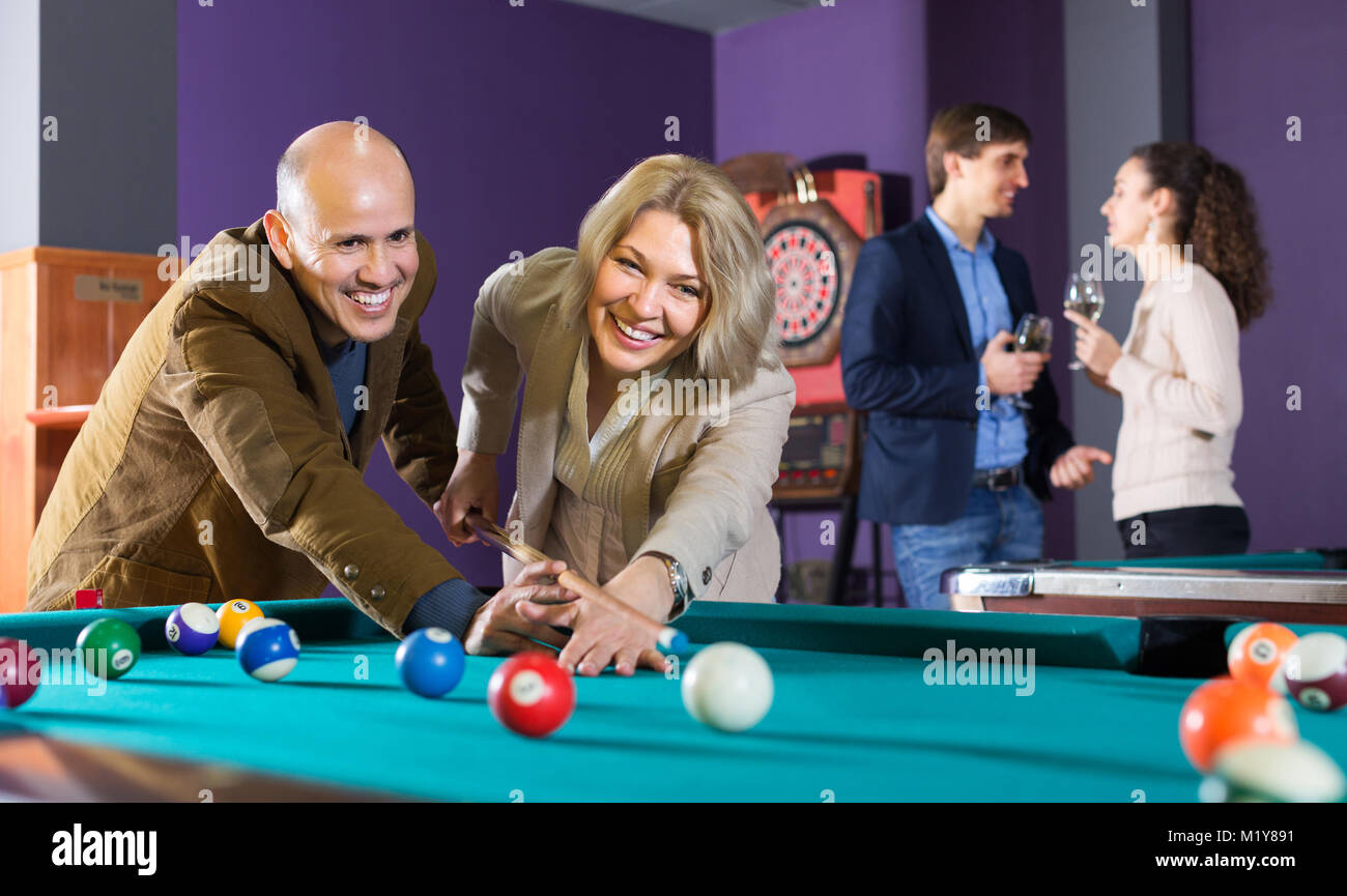 Happy couples playing billiards hi-res stock photography and images - Alamy