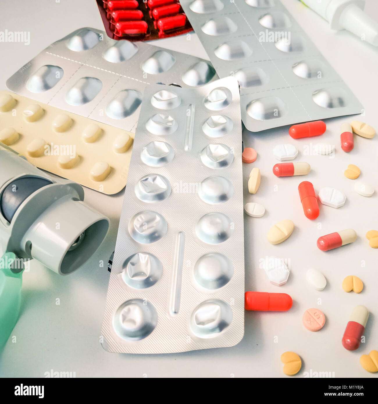 Medication white and colorful tablets arranged abstract on white color ...