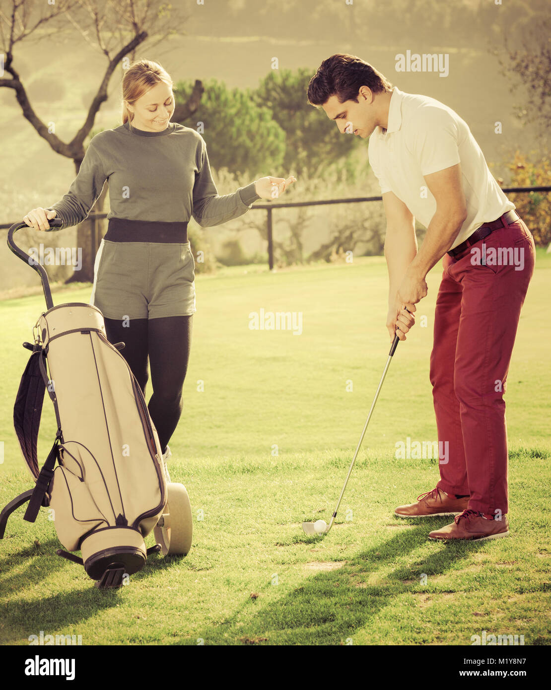 Glad golf partners playing tour of golf at golf course together Stock ...