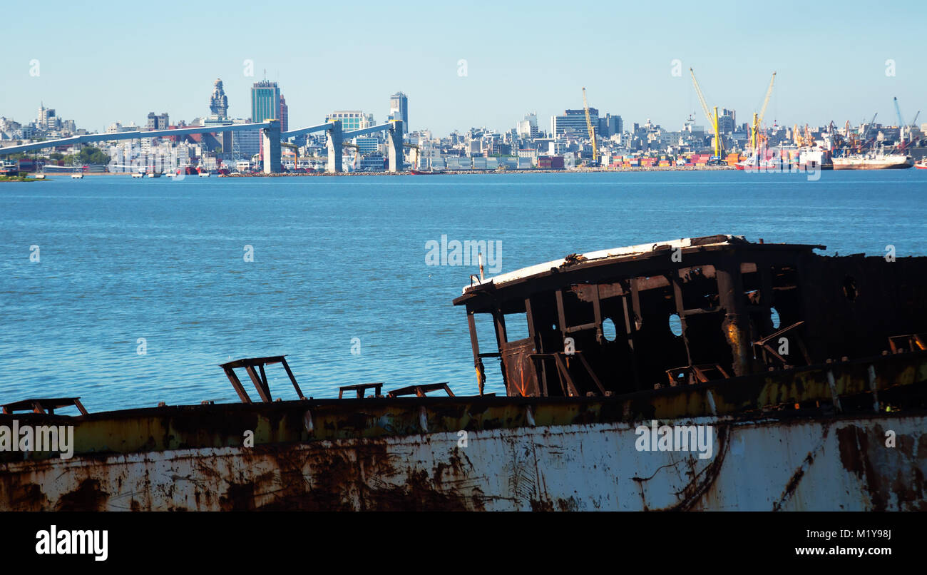 Panoramic view of contrasting cityscapes of port area in Montevideo ...